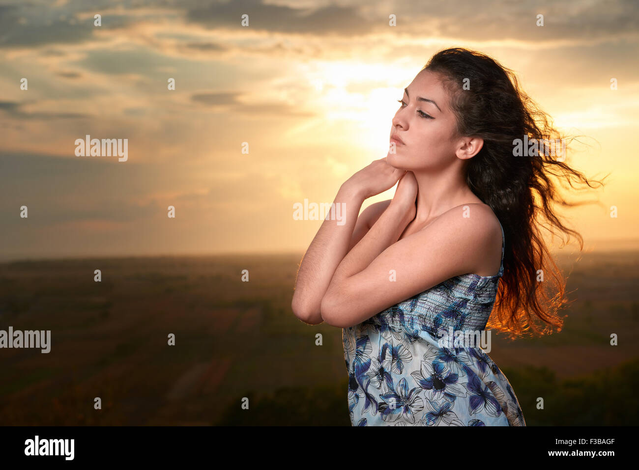 girl portrait at sunset on plain background Stock Photo - Alamy