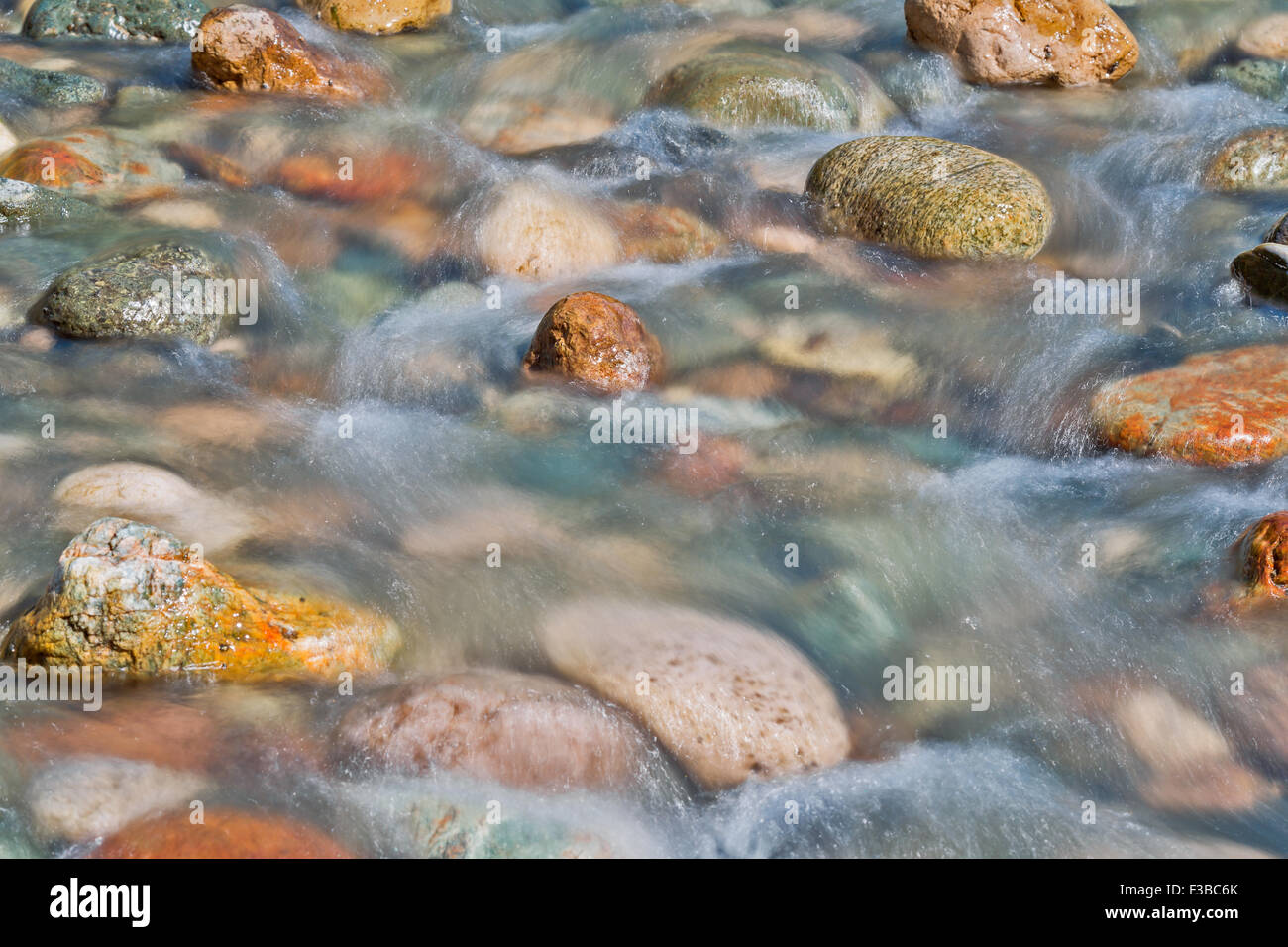 Pebble stones in the river water close up view, natural background ...
