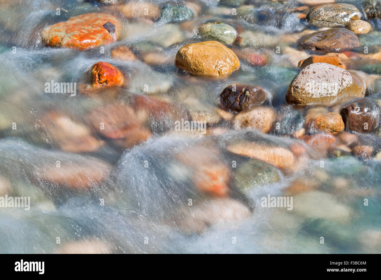 Pebble stones in the river water close up view, natural background ...