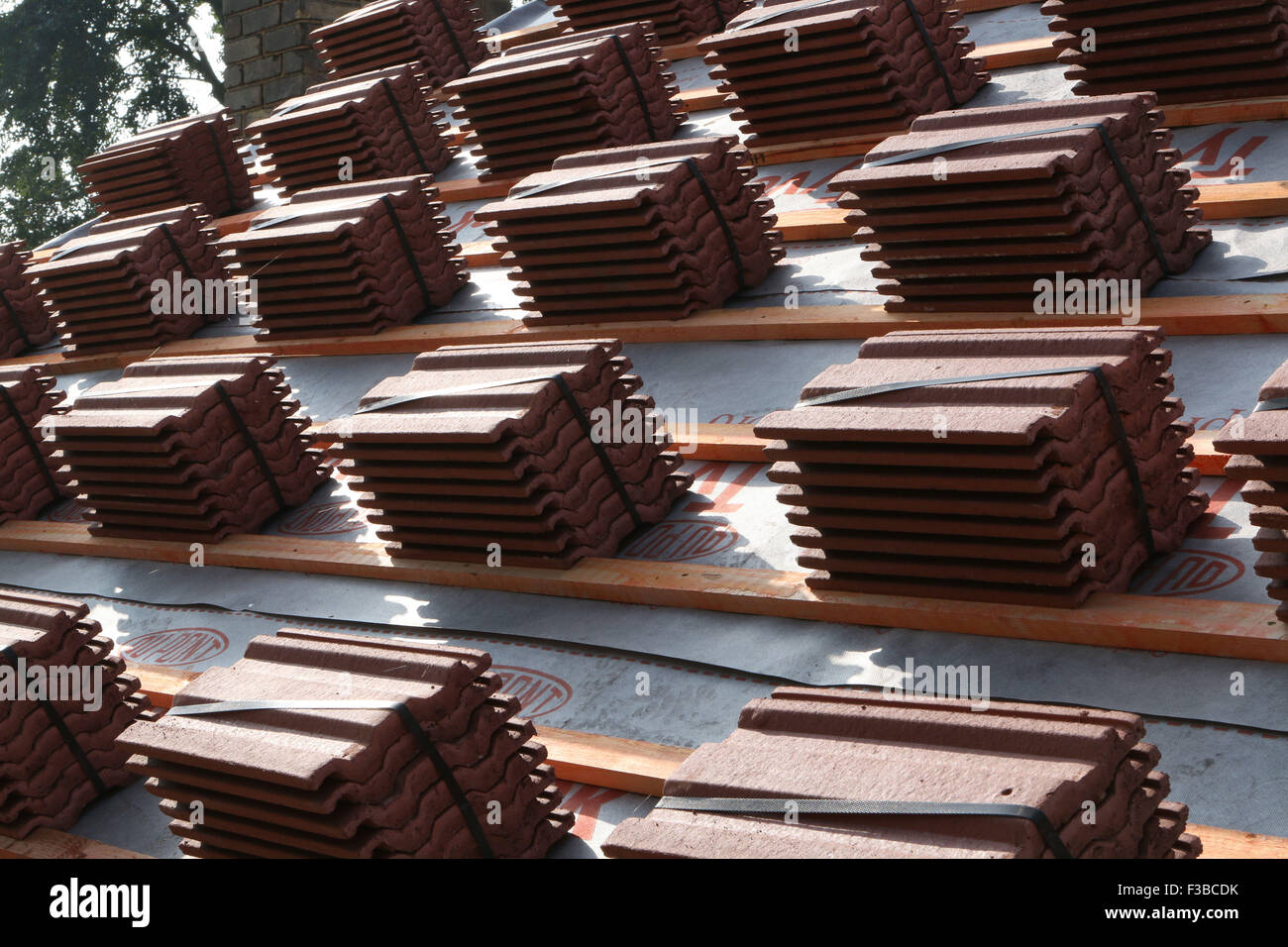 Roof tiles stacked on a roof Stock Photo - Alamy