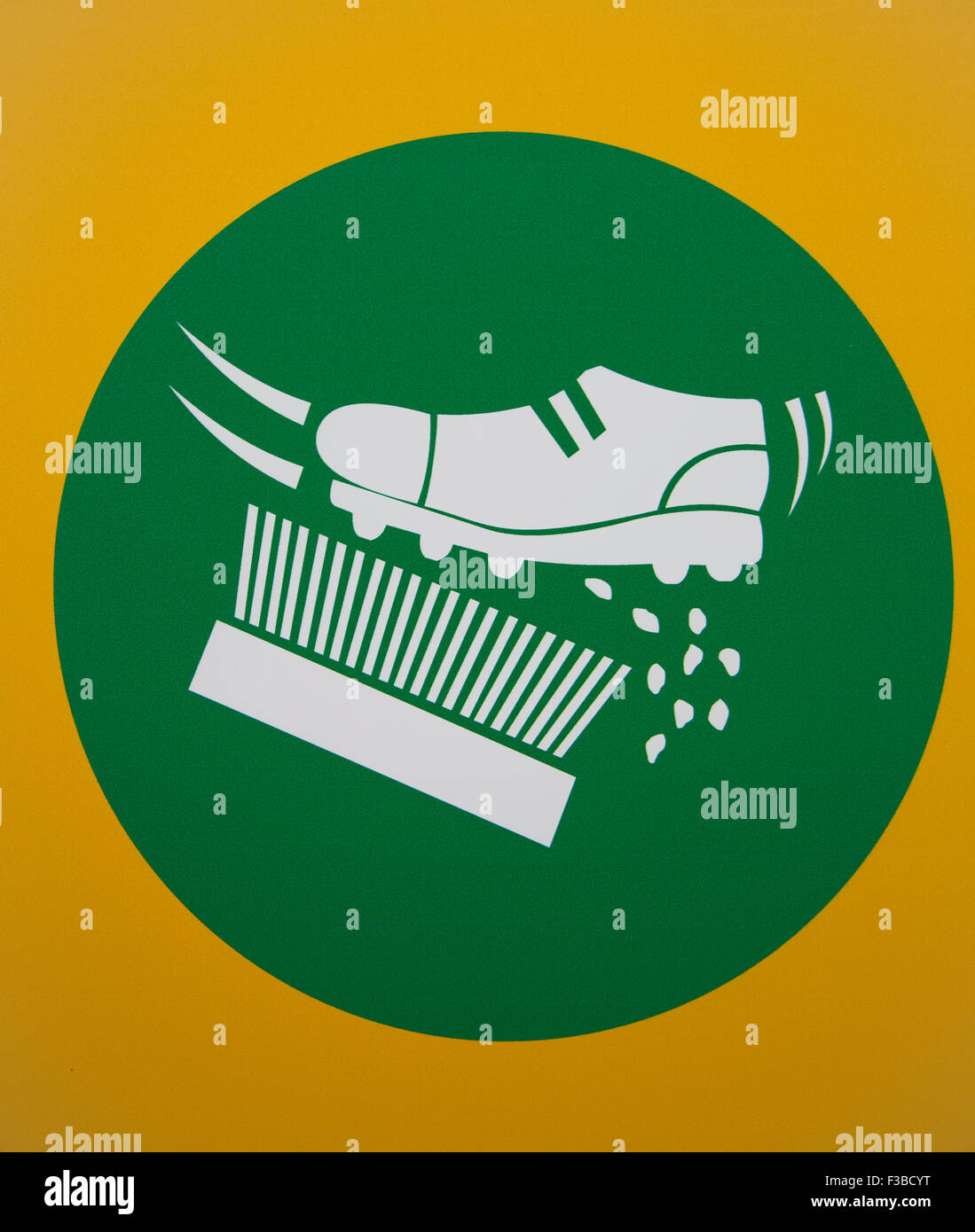 Request sign by a astro turf football field Stock Photo - Alamy