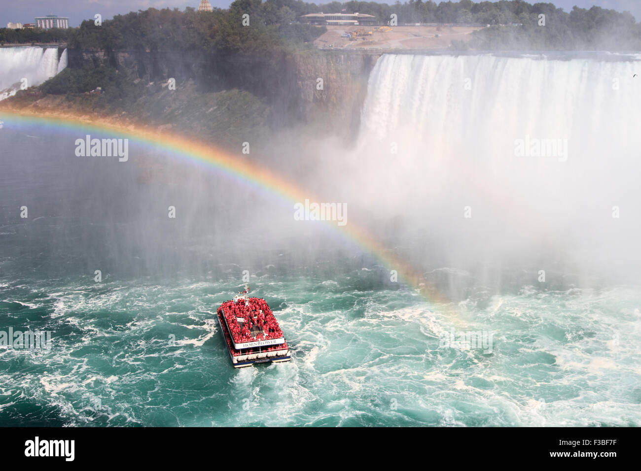 Tour boat and rainbow Stock Photo - Alamy