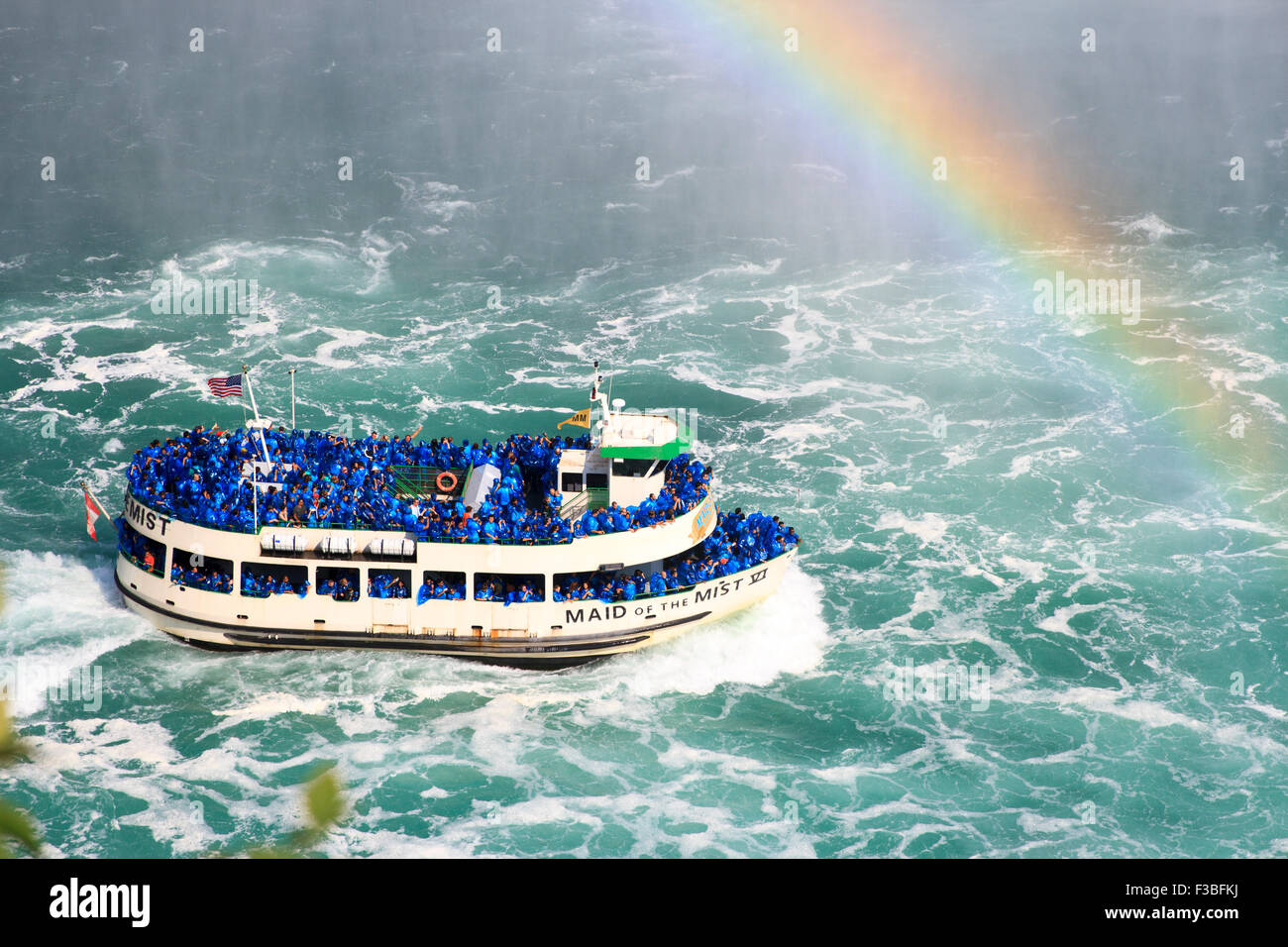 Tour boat & Rainbow Stock Photo - Alamy
