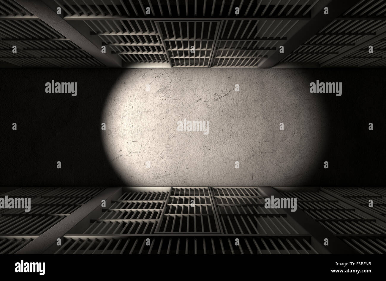A direct top view of a row of closed jail cells between a concrete ...