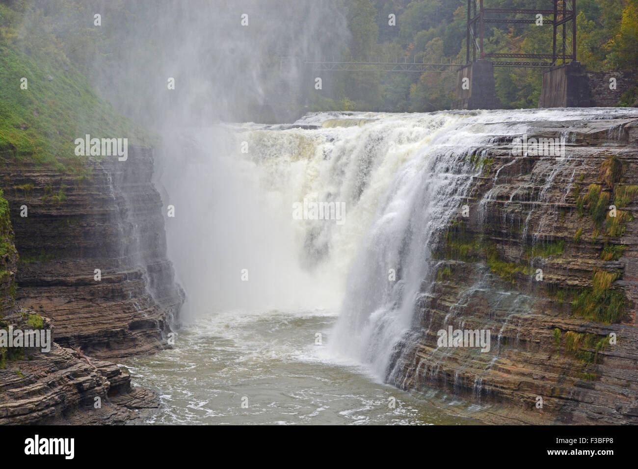 Waterfall with rising mist Stock Photo - Alamy