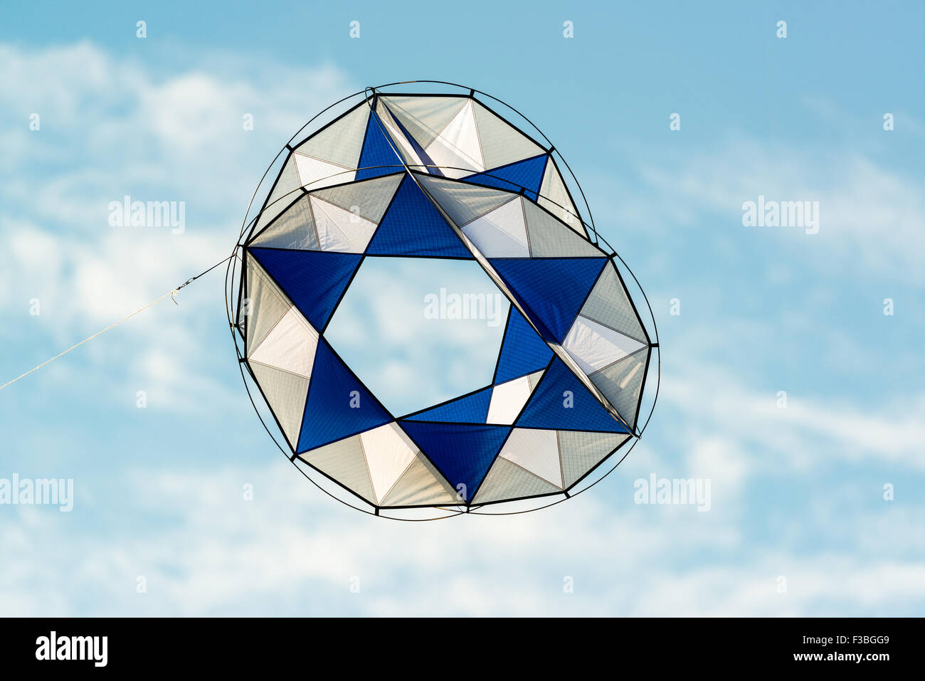 modern kite flying in blue sky Stock Photo - Alamy