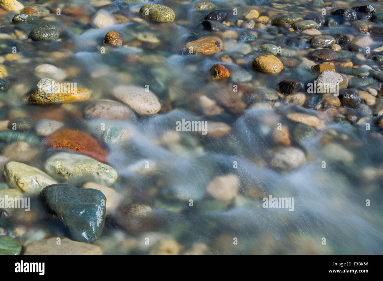 Pebble stones in the river water close up view, natural background ...