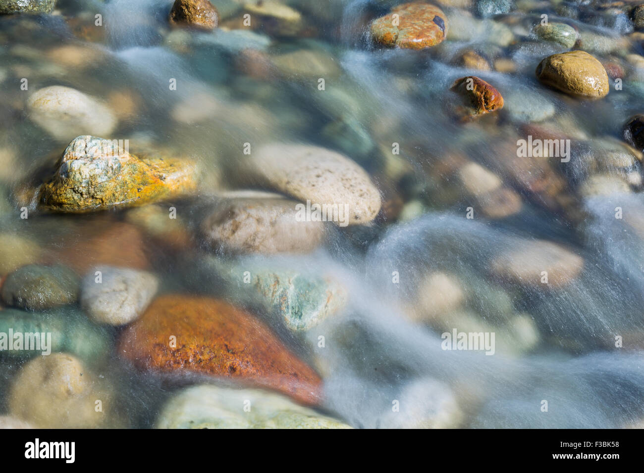 Pebble stones in the river water close up view, natural background ...