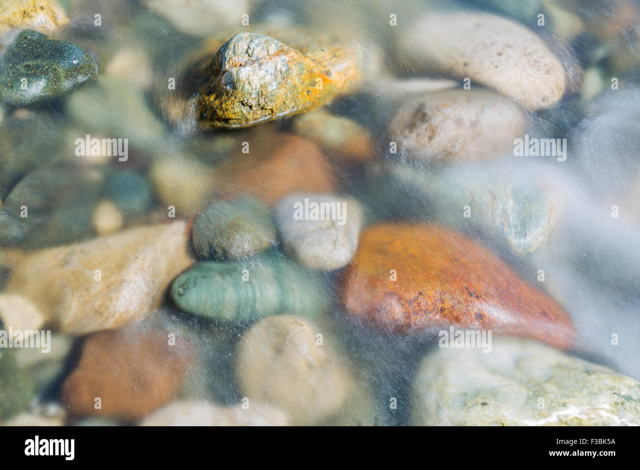 Pebble stones in the river water close up view, natural background ...