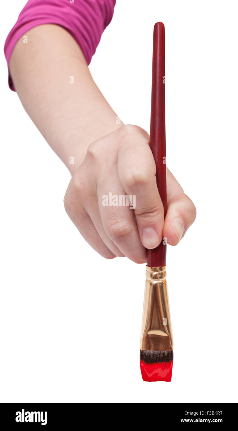 front view of hand with red artistic flat paint brush isolated on white ...