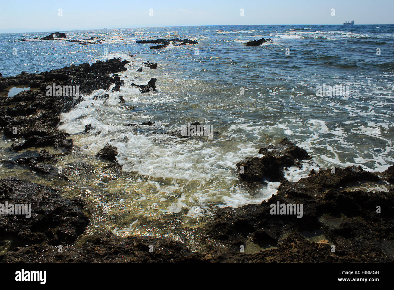 Rocks being hit by waves in Bozcaada, Canakkale, Turkey Stock Photo - Alamy