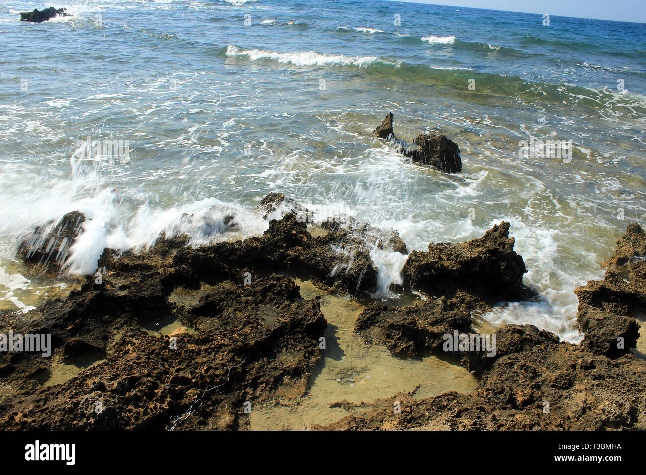 Rocks being hit by waves in Bozcaada, Canakkale, Turkey Stock Photo - Alamy