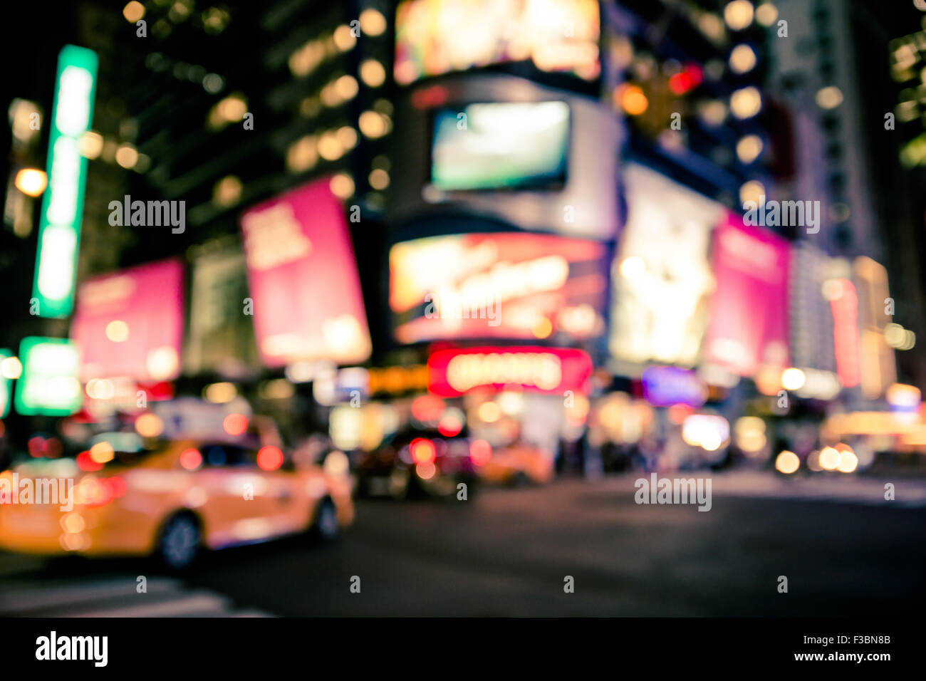 Defocused blur of Times Square in New York City with lights at night ...