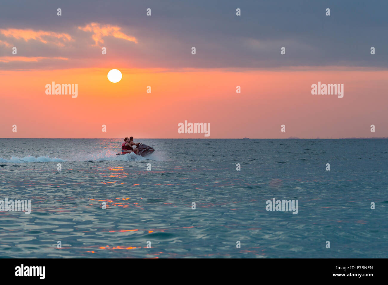 Couple riding jet ski hi-res stock photography and images - Alamy