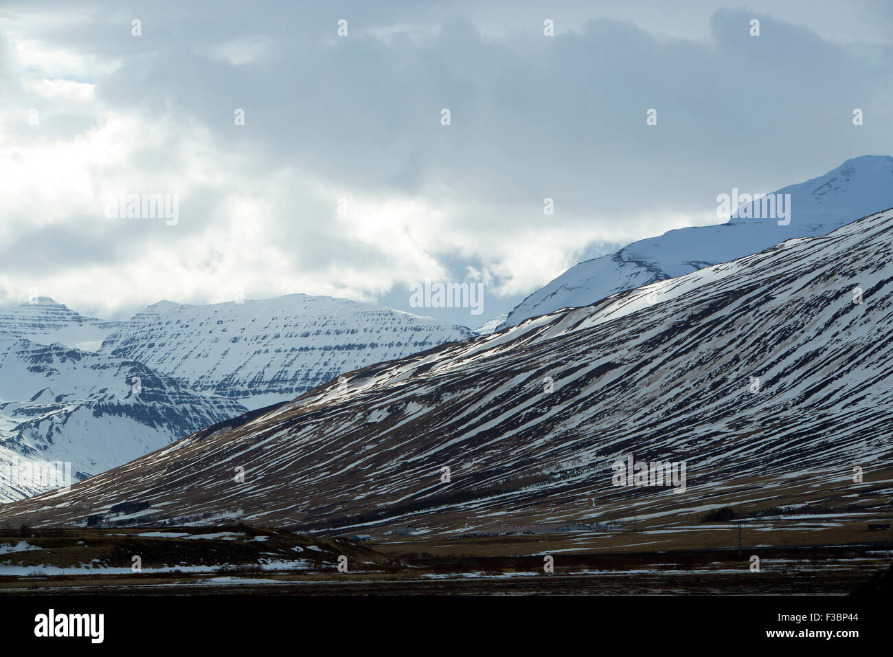Snow-covered volcanic mountain landscape in Iceland Stock Photo - Alamy