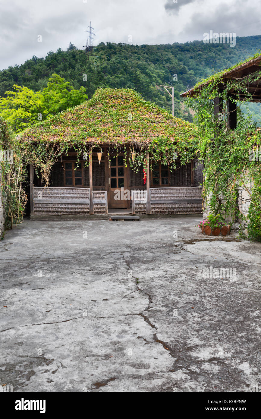 Traditional caucasian wicker hut with ivy roof Stock Photo - Alamy