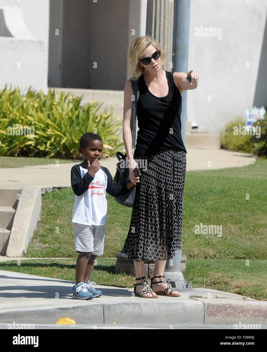 Actress Charlize Theron heads to a friends in Los Angeles house with ...