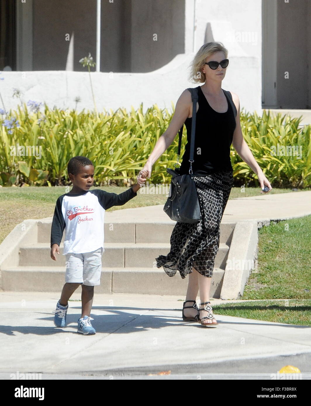 Actress Charlize Theron heads to a friends in Los Angeles house with ...