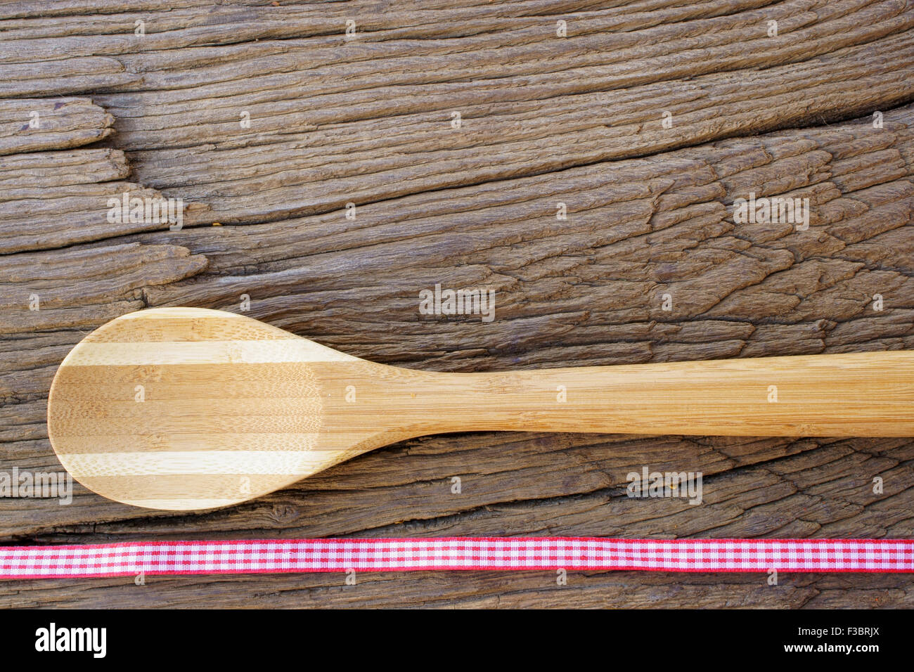 Cooking Spoon on wooden on rustic background with fabric ribbon and ...