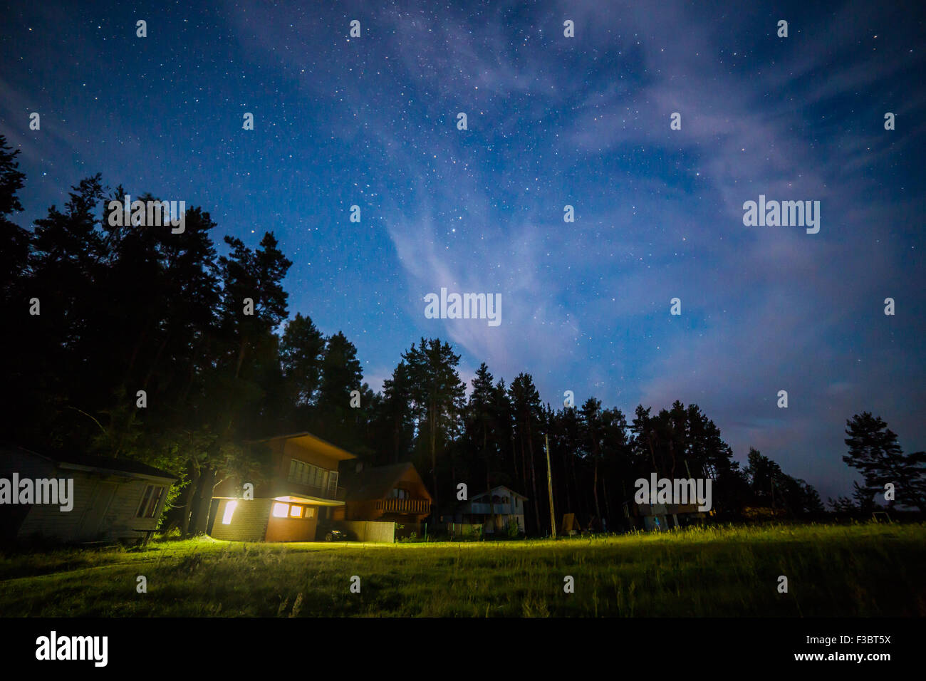 Night scene with small cottages and stars in the sky Stock Photo - Alamy