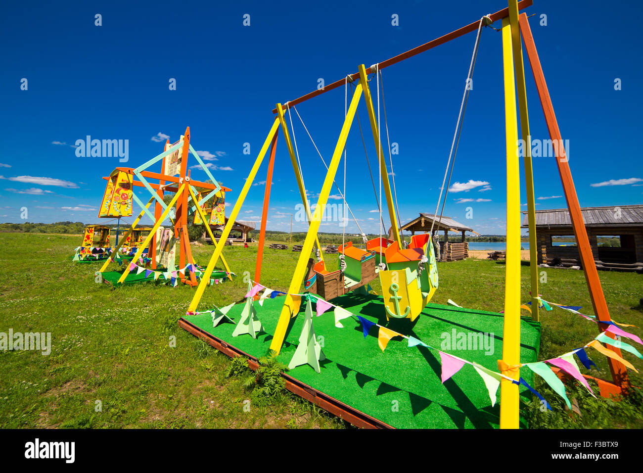 Kid's playground outdoors with traditionsal style swings Stock Photo ...