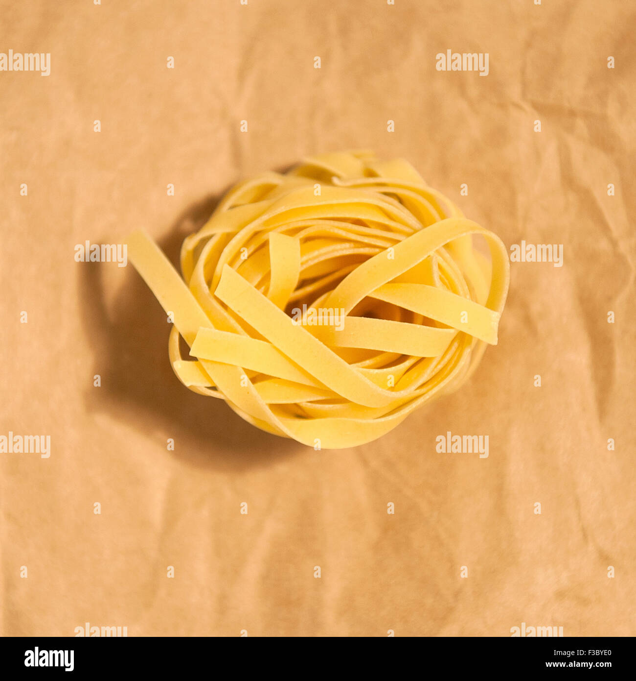 Above close-up view of a swirl of dried pasta Stock Photo - Alamy