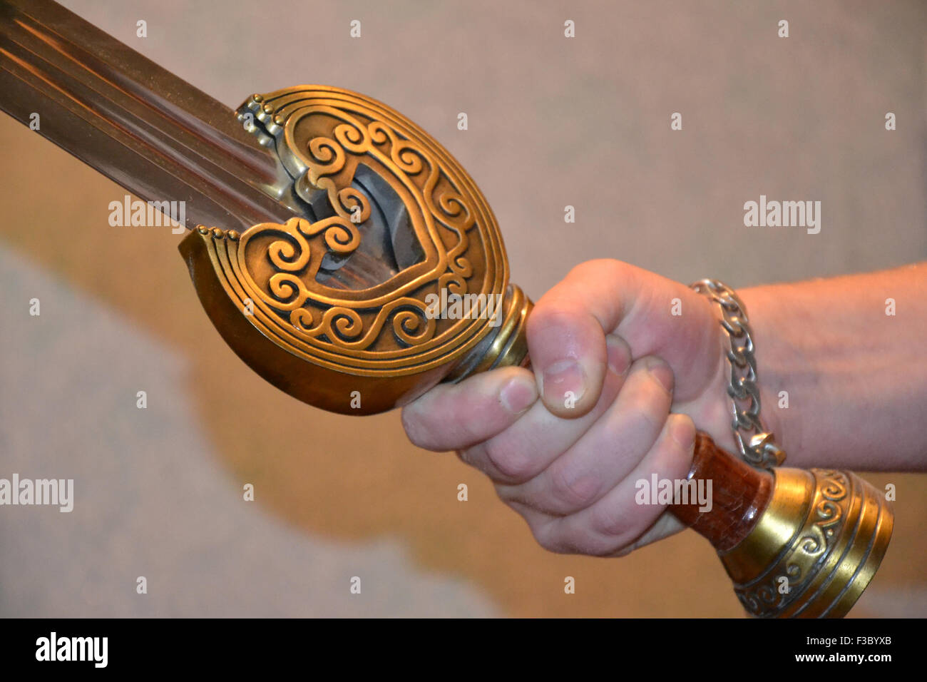 Sword at a hand. Fitting of the knightly weapon Stock Photo - Alamy