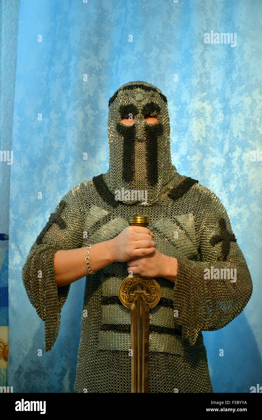 Knightly chain armor and sword. Fitting of a knightly armor Stock Photo ...
