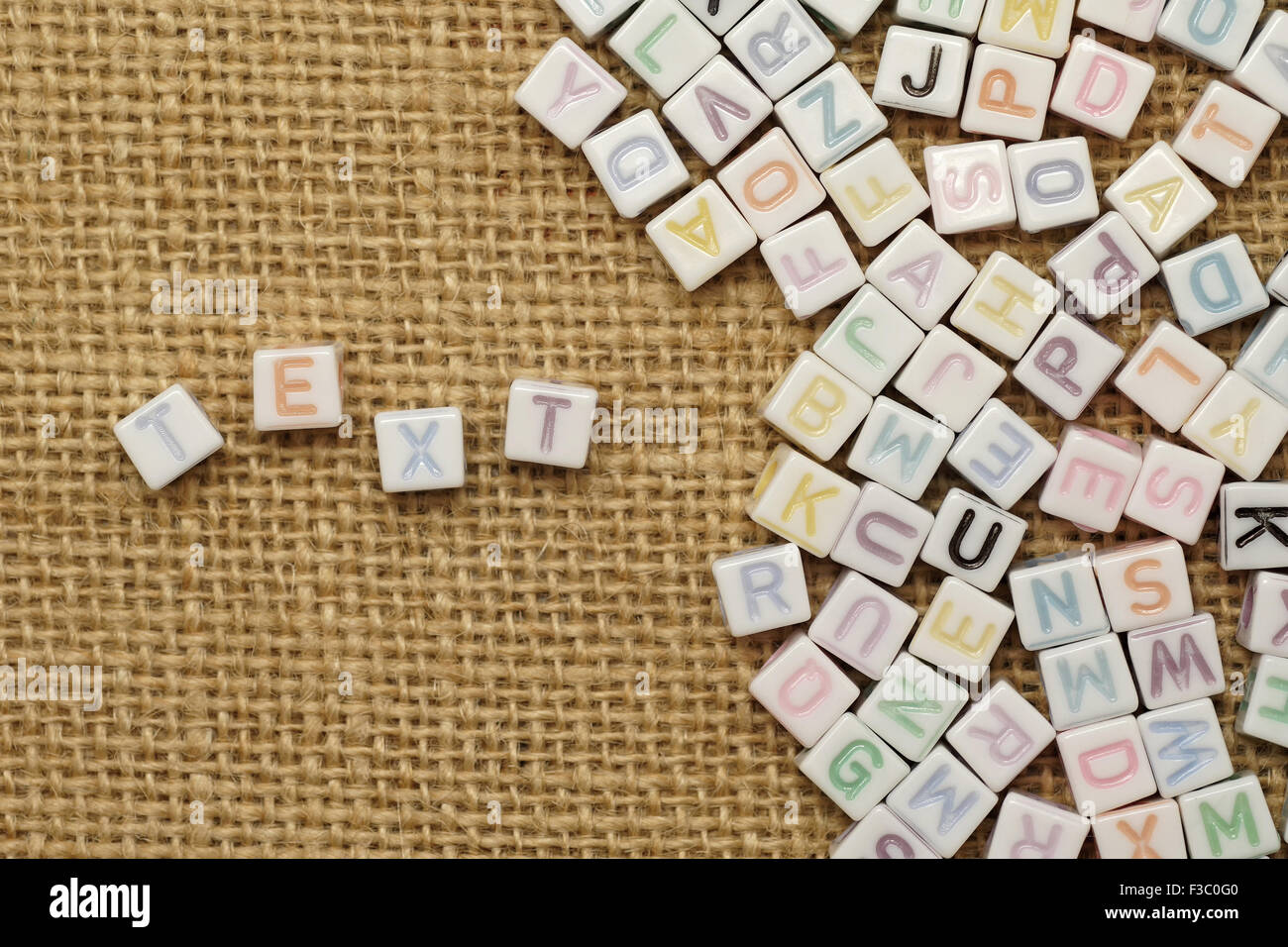 colorful word text on burlap fabric background Stock Photo - Alamy
