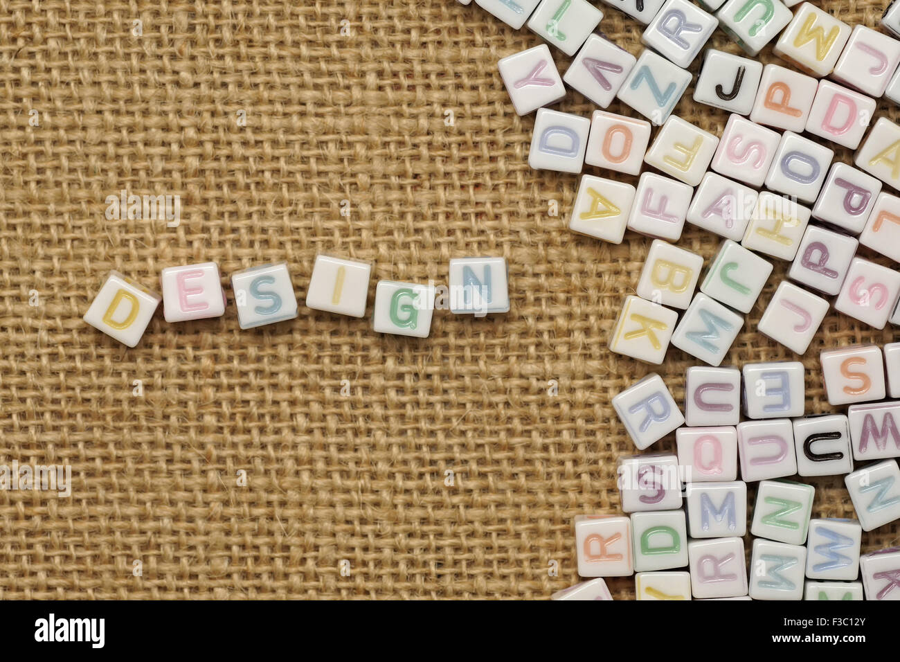 colorful word design on burlap fabric background Stock Photo - Alamy