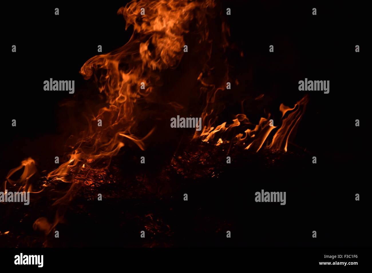 Fire fire. Burning of rice straw at night Stock Photo - Alamy