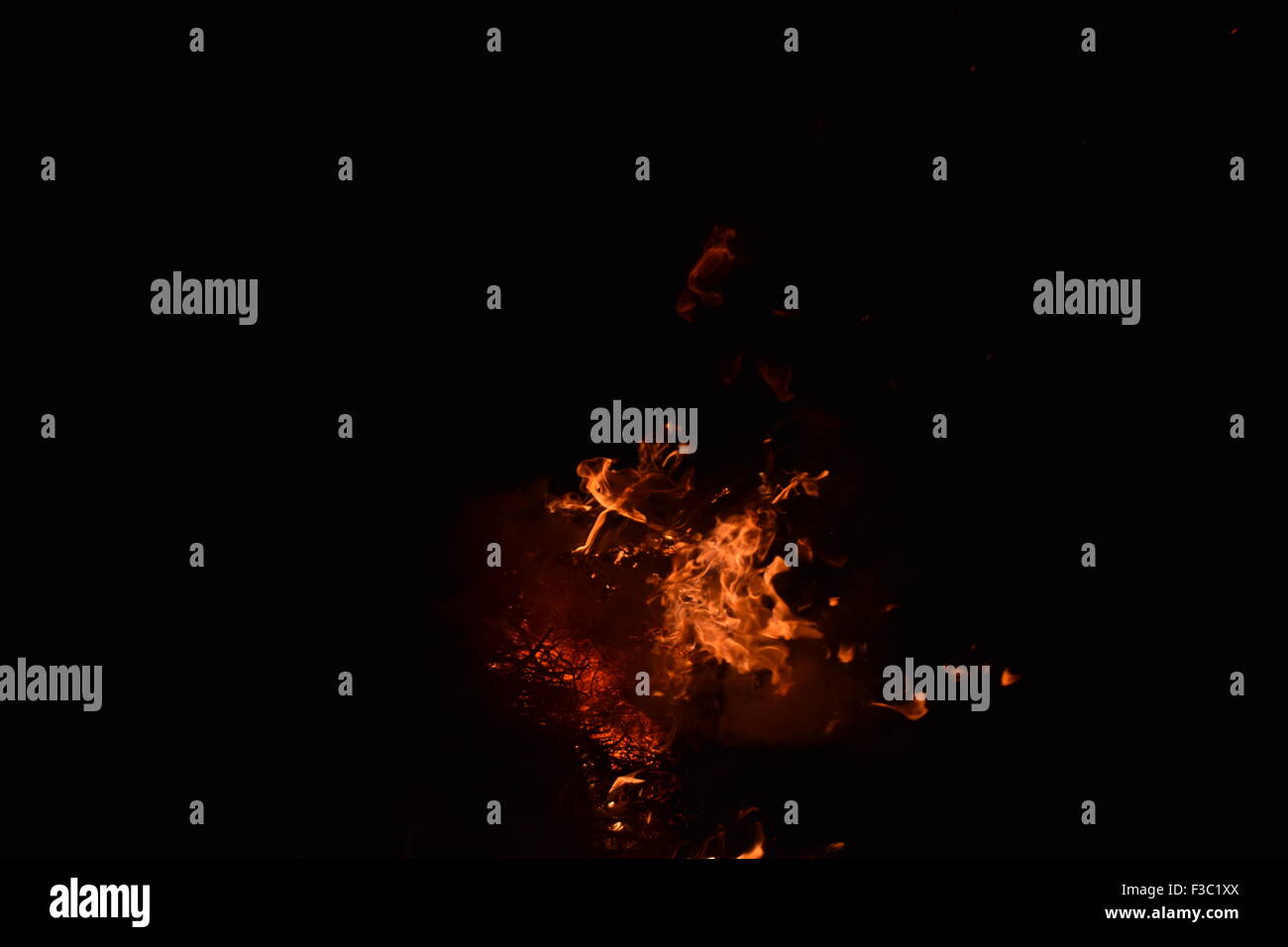Fire fire. Burning of rice straw at night Stock Photo - Alamy