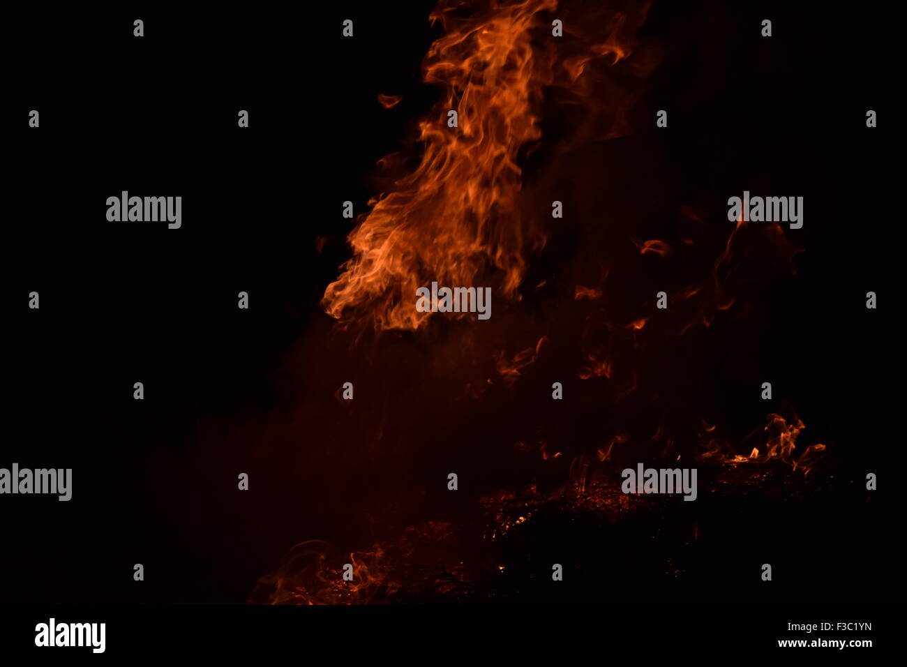 Fire fire. Burning of rice straw at night Stock Photo - Alamy