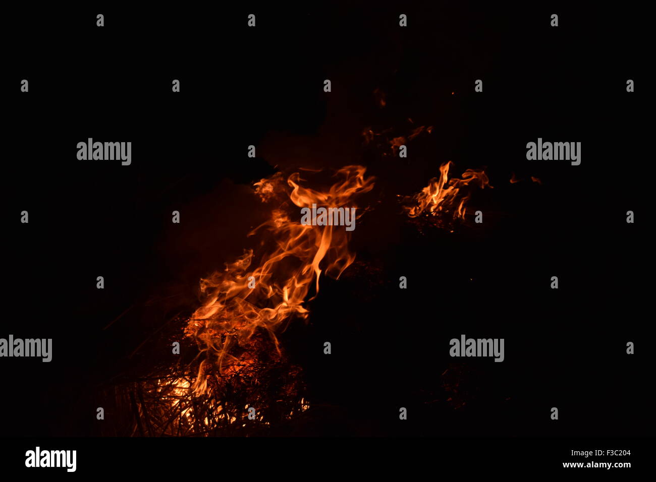 Fire fire. Burning of rice straw at night Stock Photo - Alamy