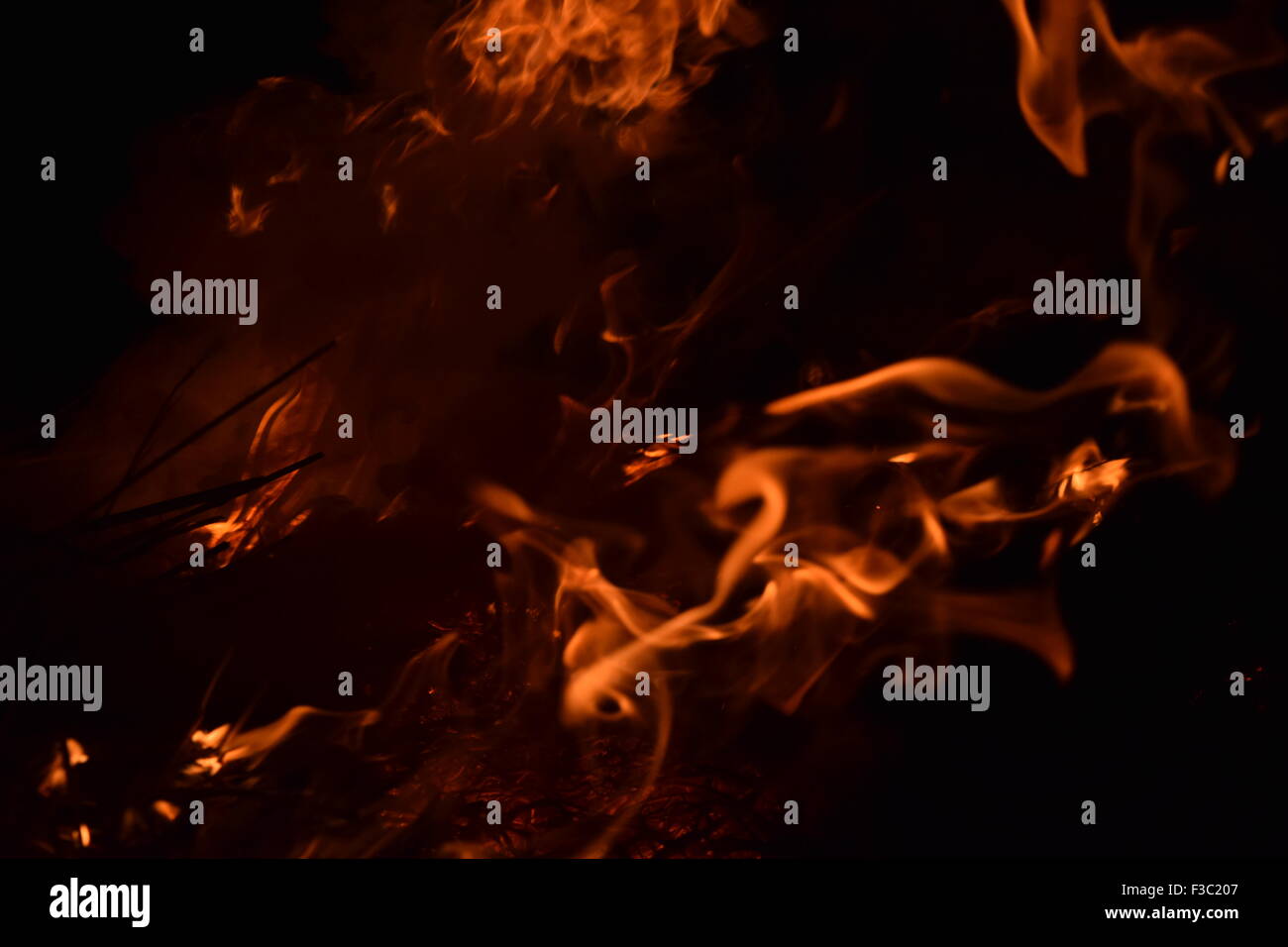 Fire fire. Burning of rice straw at night Stock Photo - Alamy
