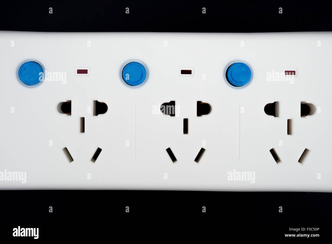 multi sockets power extension with switches on black background close ...