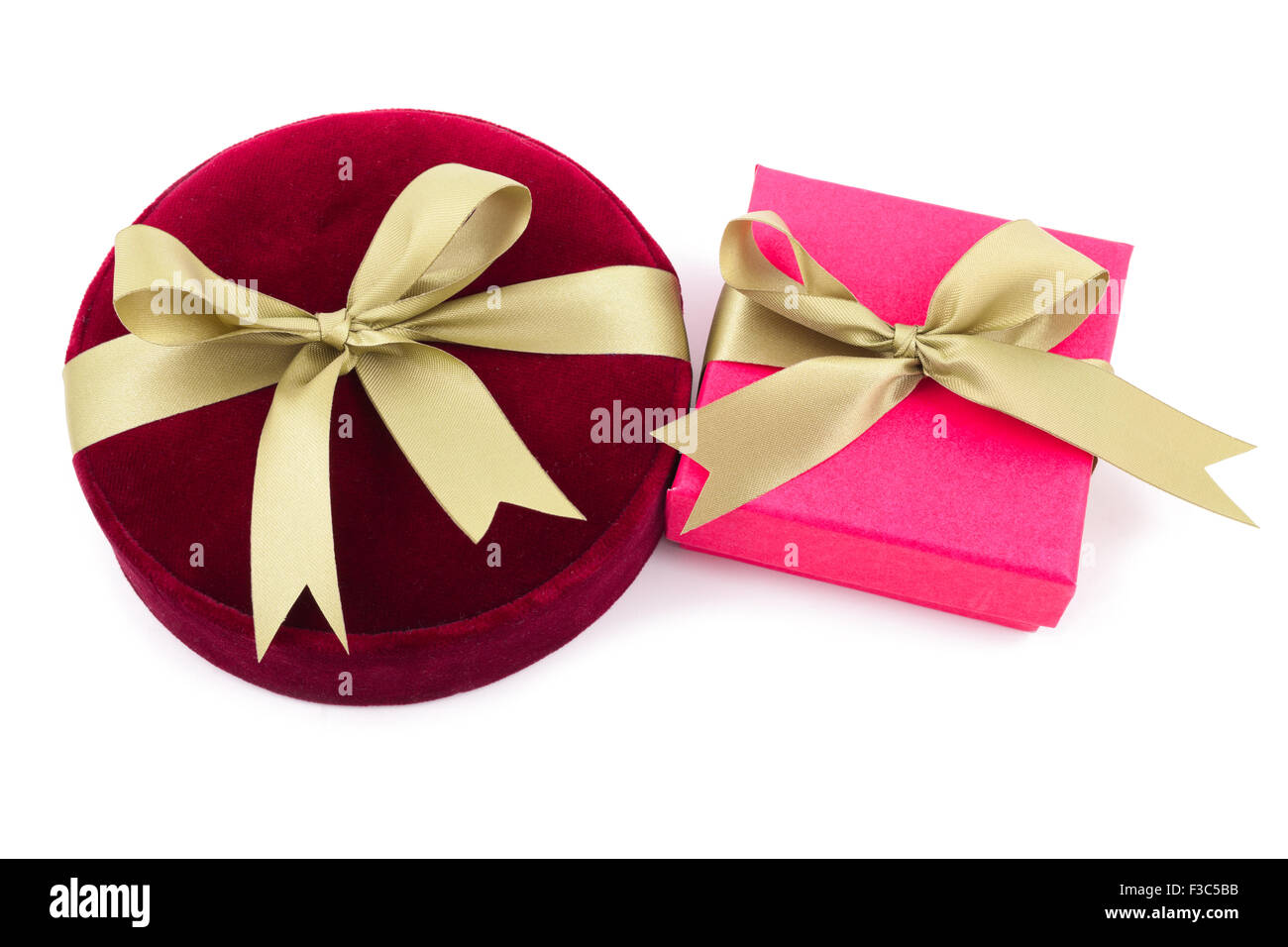 Luxury gift boxes in dark red and brown shades with green satin ribbon ...