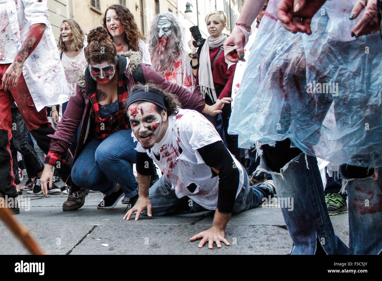 Turin, Italy. 04th Oct, 2015. Participants dress as zombies join in the ...