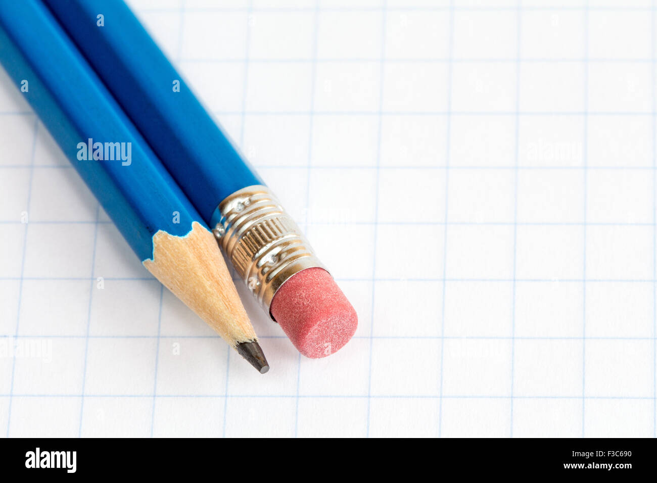 Two pencils on the square paper with copy soace Stock Photo - Alamy