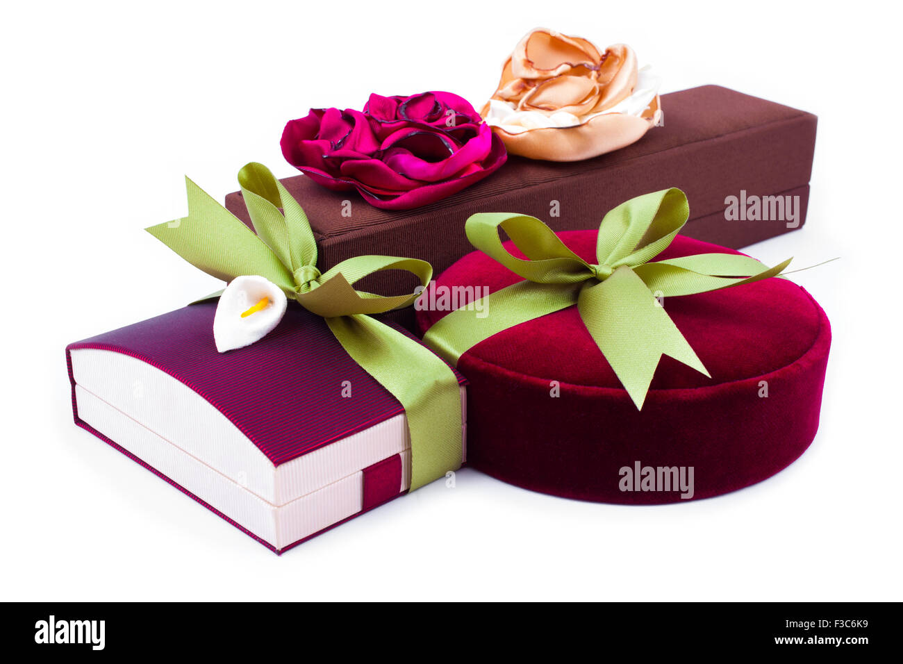 Luxury gift boxes in dark red and brown shades with green satin ribbon ...