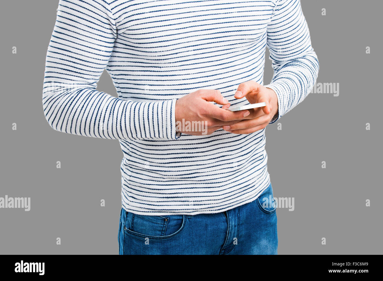 Young man sending a text message, isolated on white background Stock ...