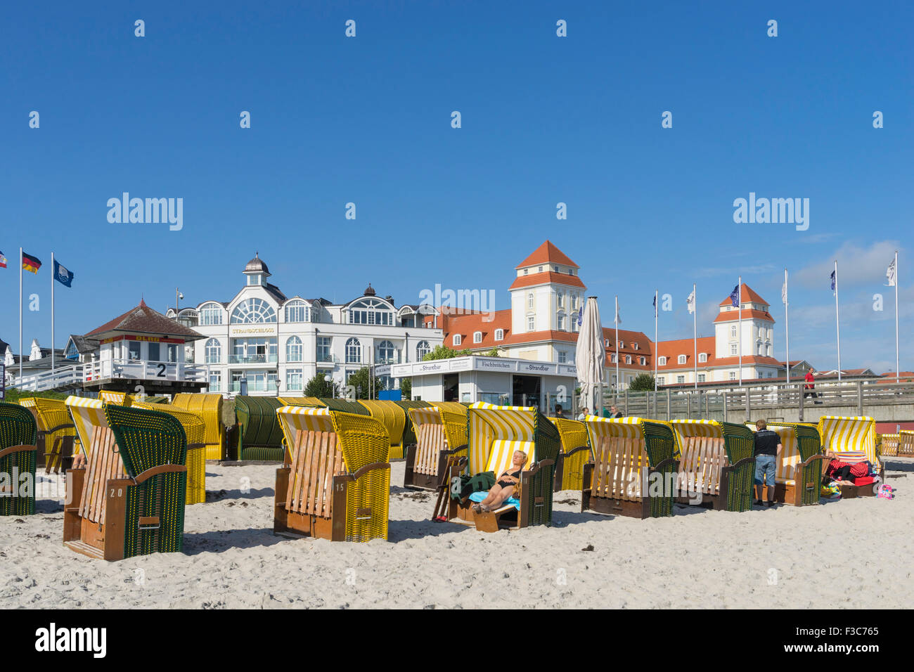 View of traditional Strandkorb seats on beach at Binz seaside resort on ...