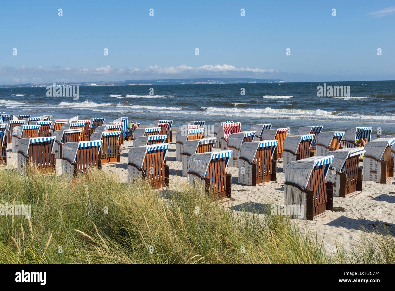 View of traditional Strandkorb seats on beach at Binz seaside resort on ...