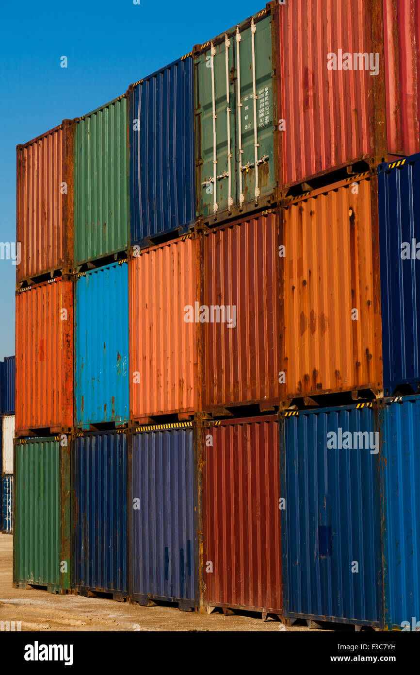 Stacked color cargo containers under the blue sky Stock Photo - Alamy
