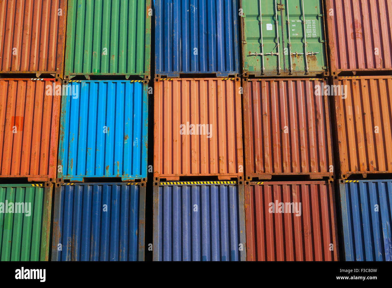 Stacked color cargo containers under the blue sky Stock Photo - Alamy