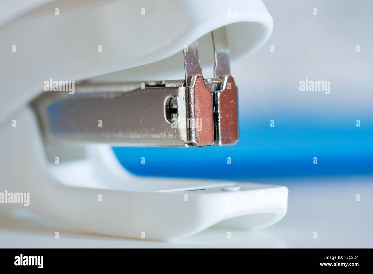 white stapler closeup Stock Photo - Alamy