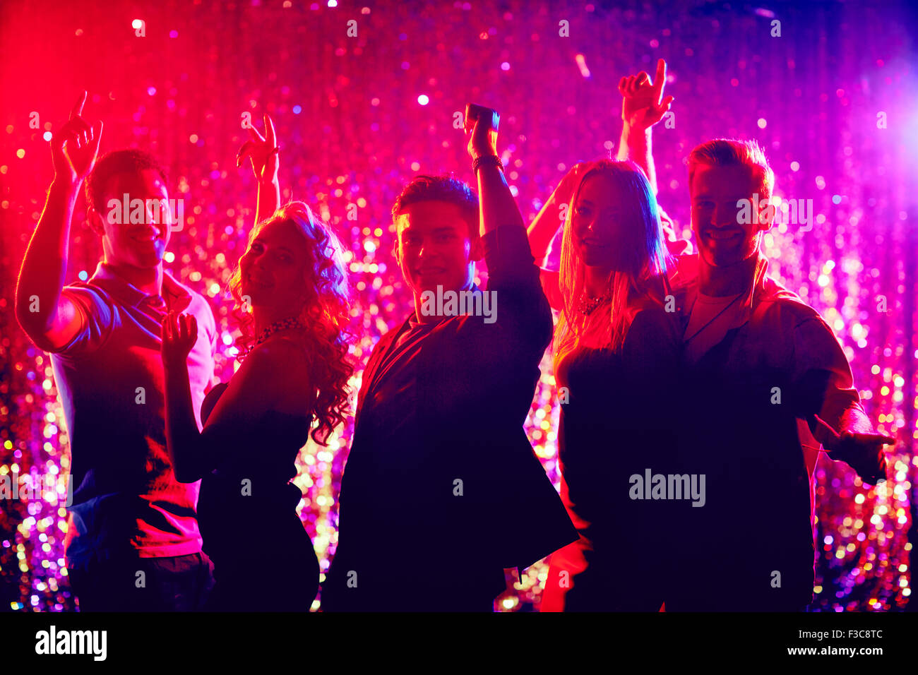 Happy friends dancing in night hi-res stock photography and images - Alamy