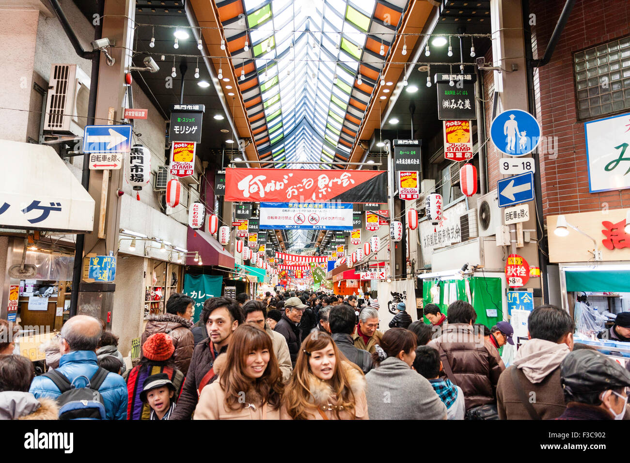 Busy scene as crowds of people make their way through the Kuromon ...