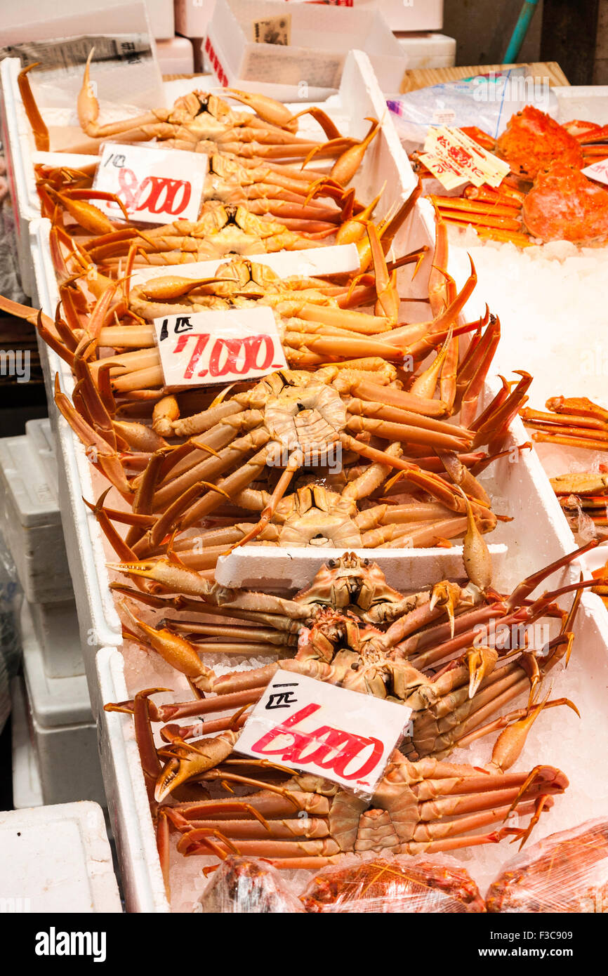 Trays of large orange crabs sorted according to size and priced at 6000 ...