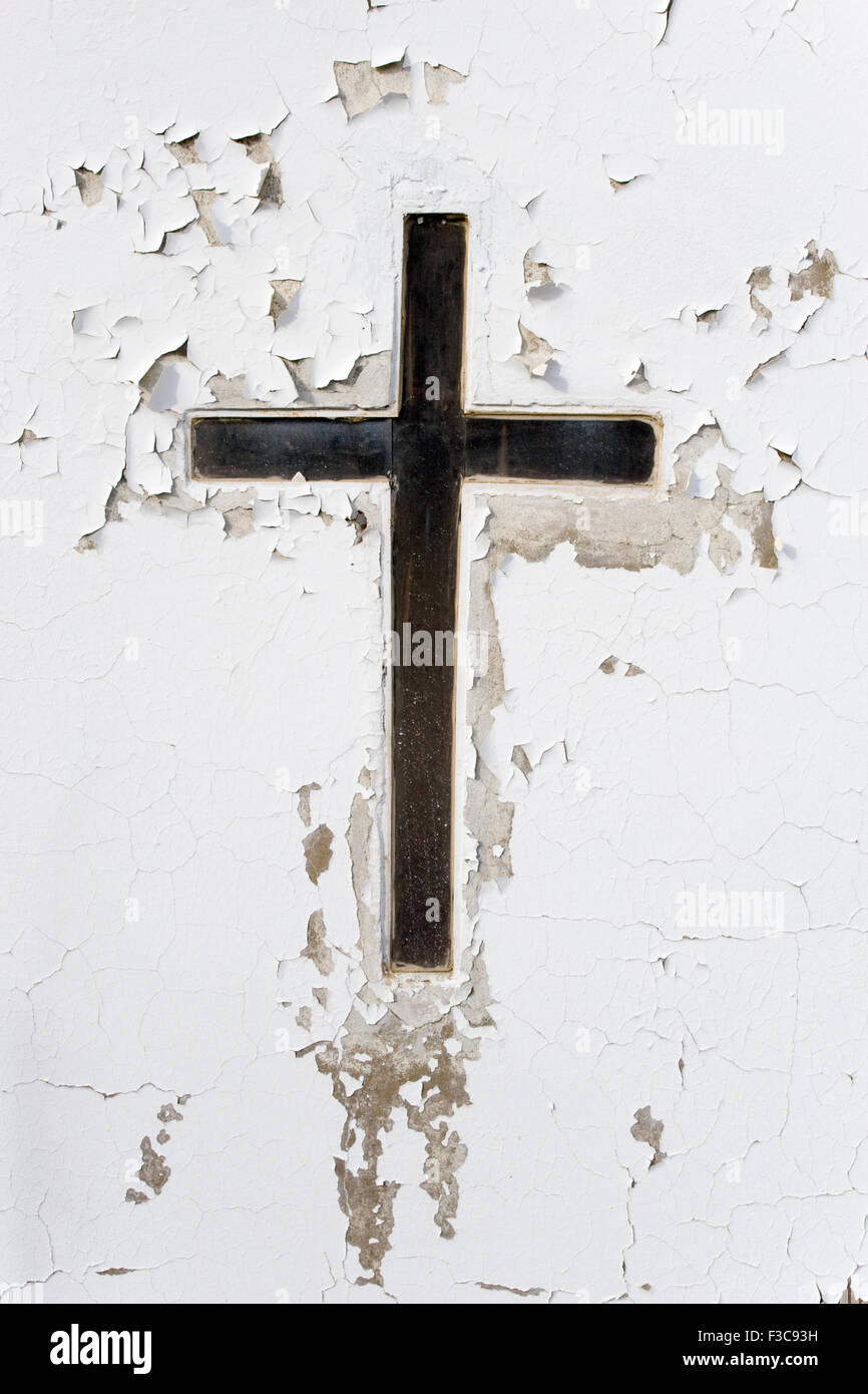 Cross on the wall Stock Photo - Alamy
